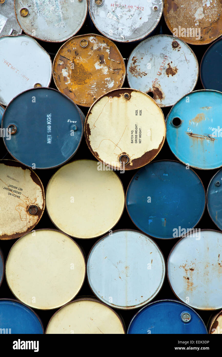 stack of old fuel tanks background Stock Photo - Alamy