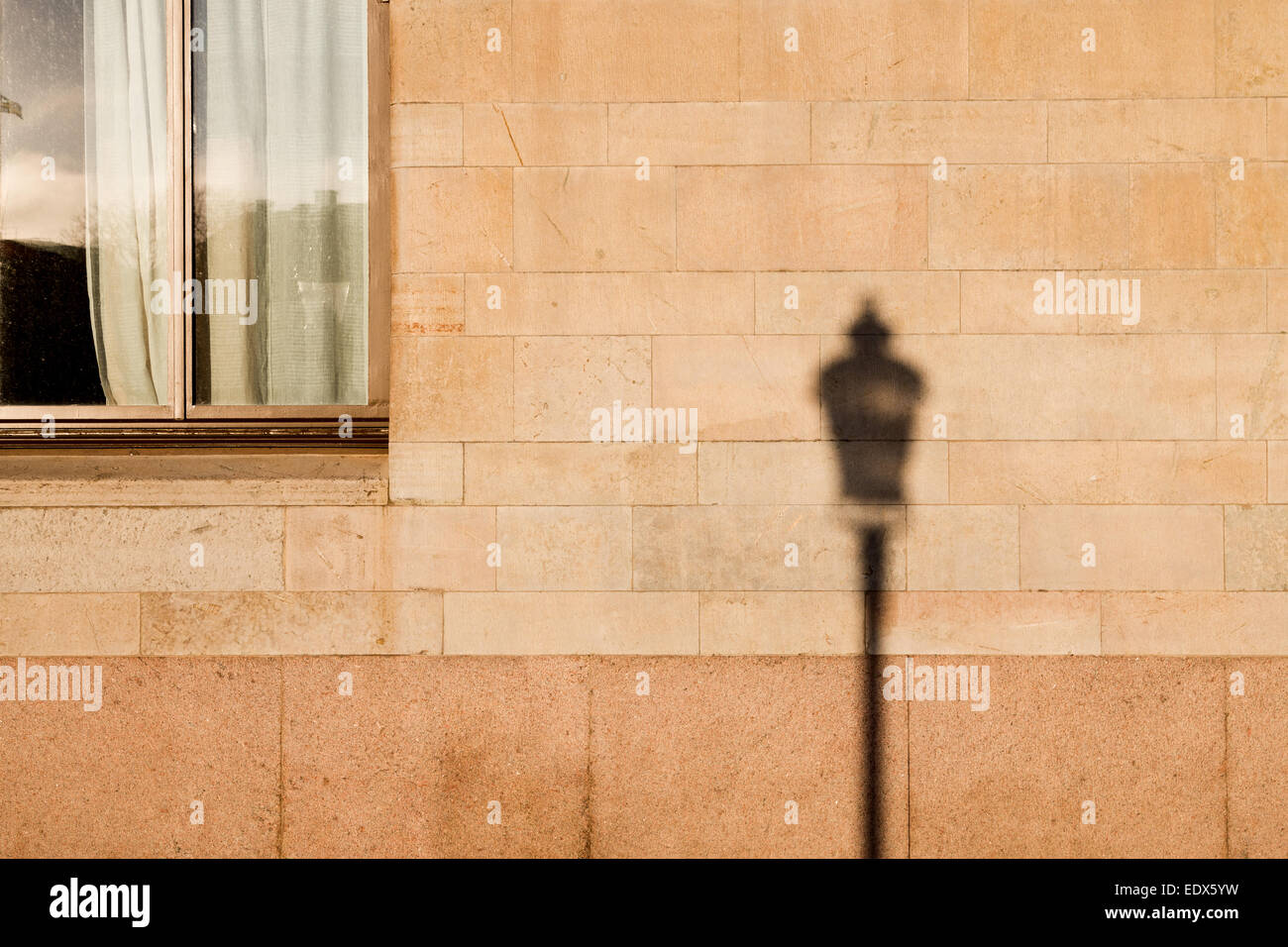Lamp post shadow on wall of house Stock Photo - Alamy