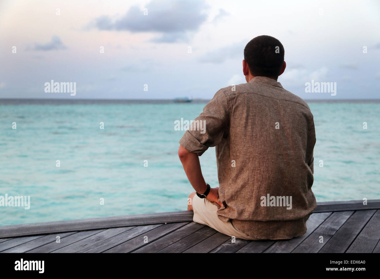 Man looking into ocean hi-res stock photography and images - Alamy