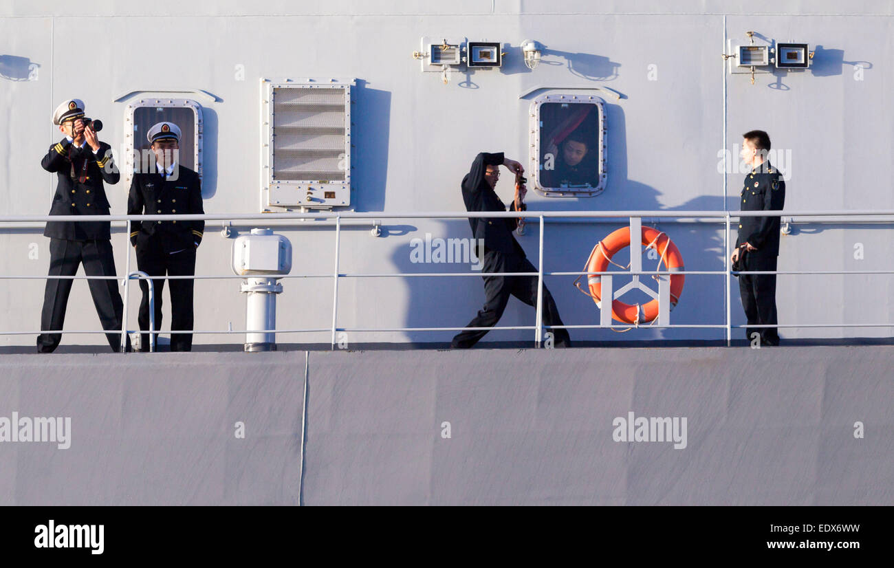 Officers aboard the Chinese Naval replenishment ship Chaohu take photos ...