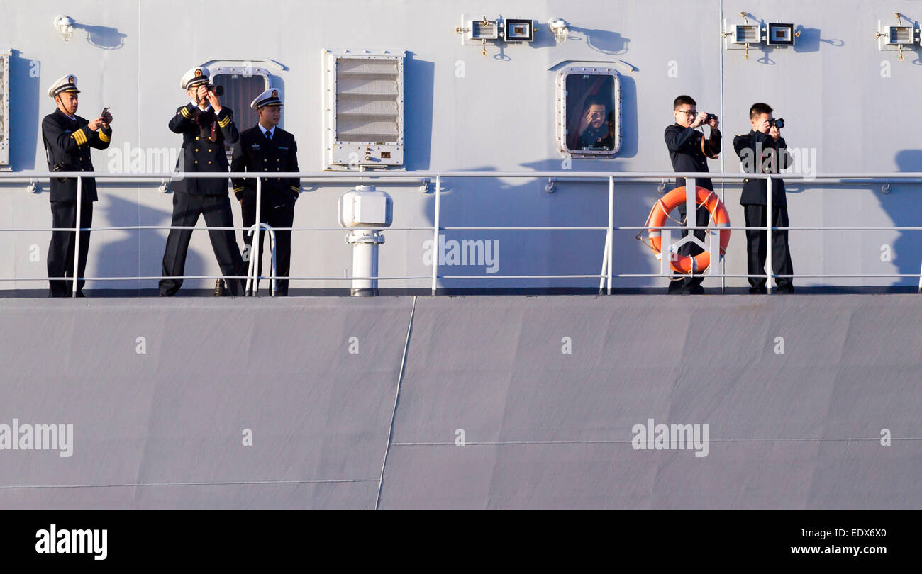Officers aboard the Chinese Naval replenishment ship Chaohu take photos ...