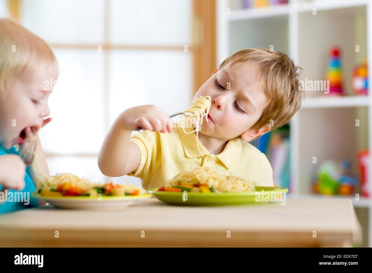 children eating healthy food in kindergarten or nursery Stock Photo - Alamy
