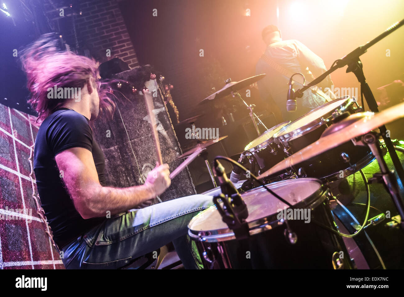Drummer playing on drum set on stage. Warning - Focus on the drum ...