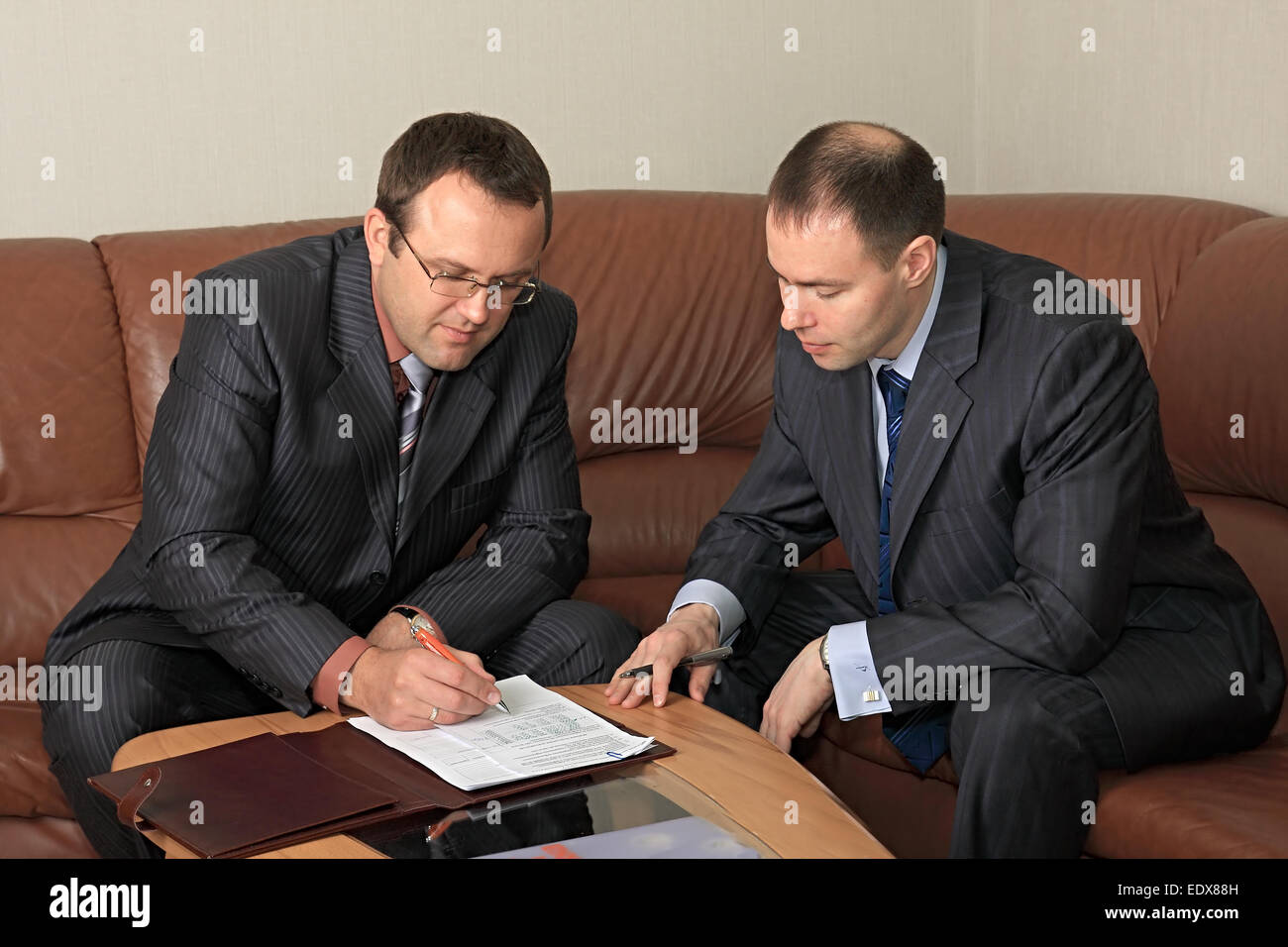 Signing of agreement Stock Photo - Alamy