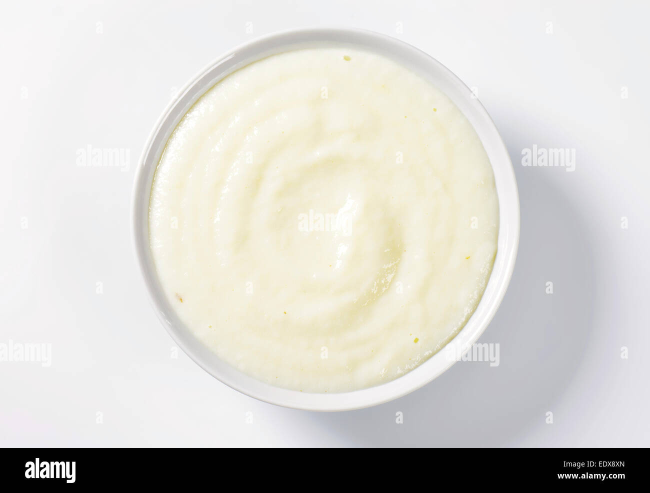 Bowl of smooth milk pudding Stock Photo - Alamy