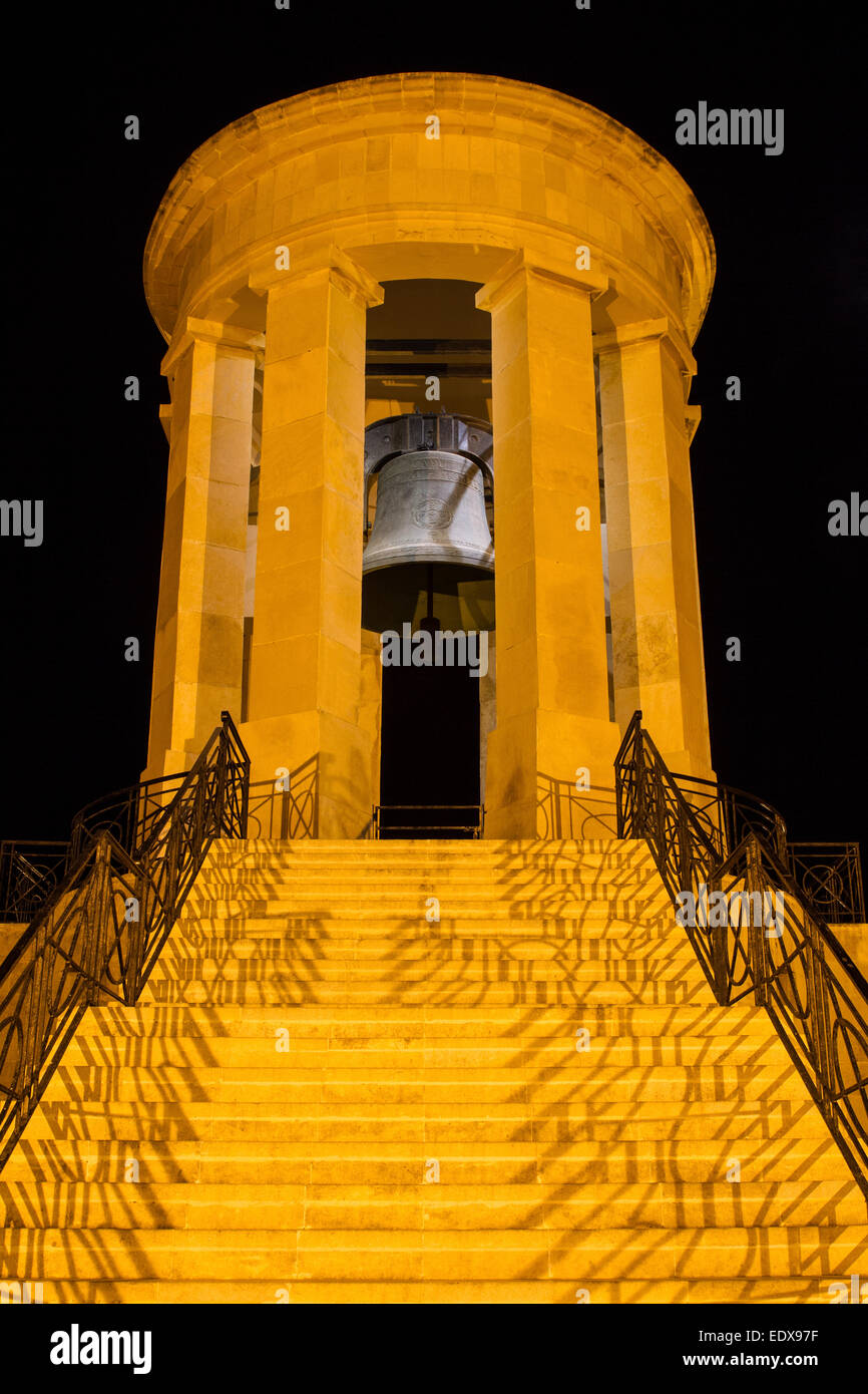 Night photograph of the Seige Bell memorial at the mouth to the Grand ...