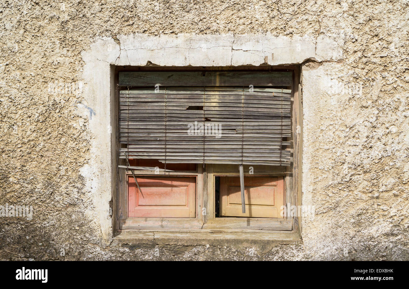 Damaged Old window with wooden frame, stone wall and broken blind Stock ...