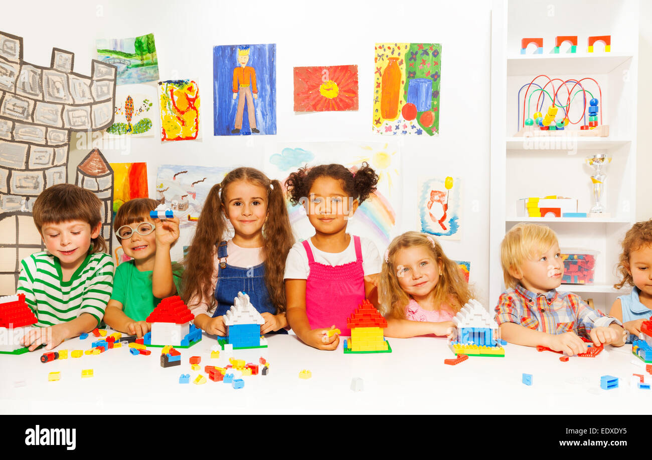 Group of little kids friends play with blocks Stock Photo - Alamy