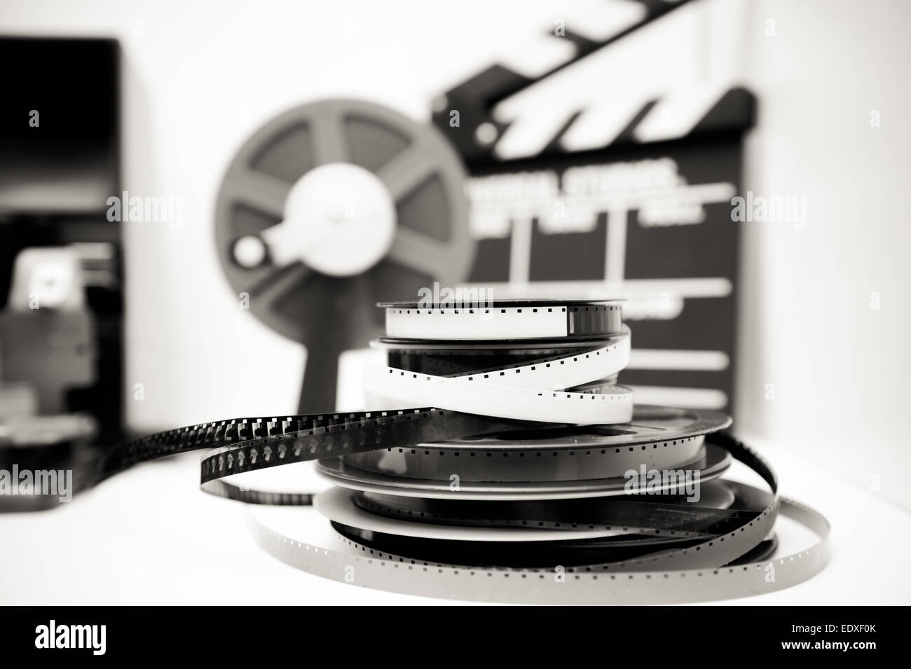 A vintage 8mm movie editing desktop in black and white with 8mm reels ...