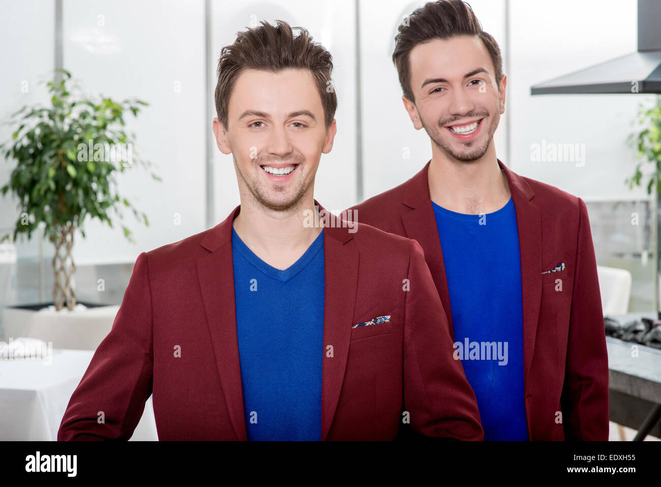 Twins in suits hi-res stock photography and images - Alamy