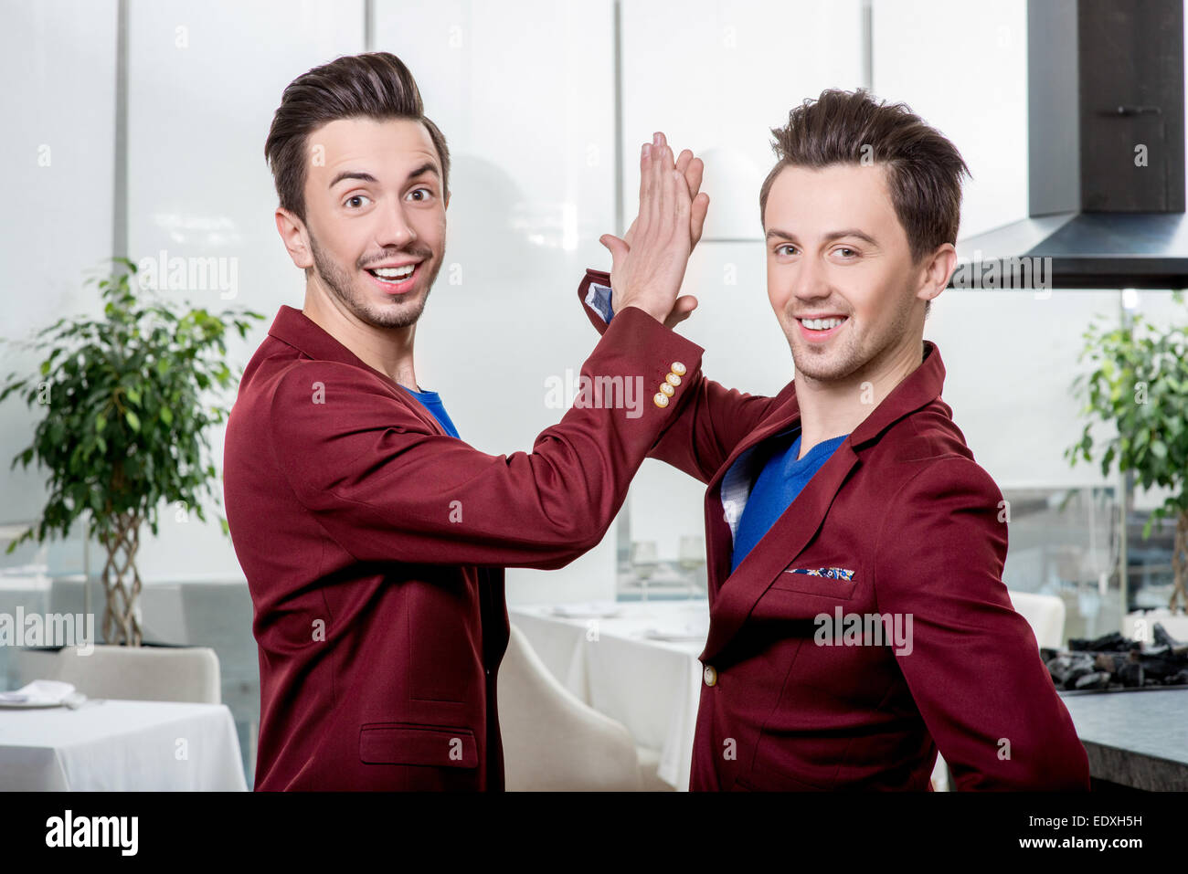 Twins in suits hi-res stock photography and images - Alamy