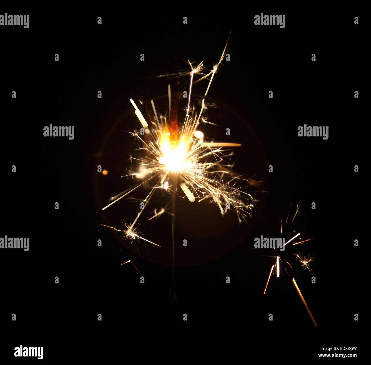 burning sparkler on a dark background Stock Photo - Alamy