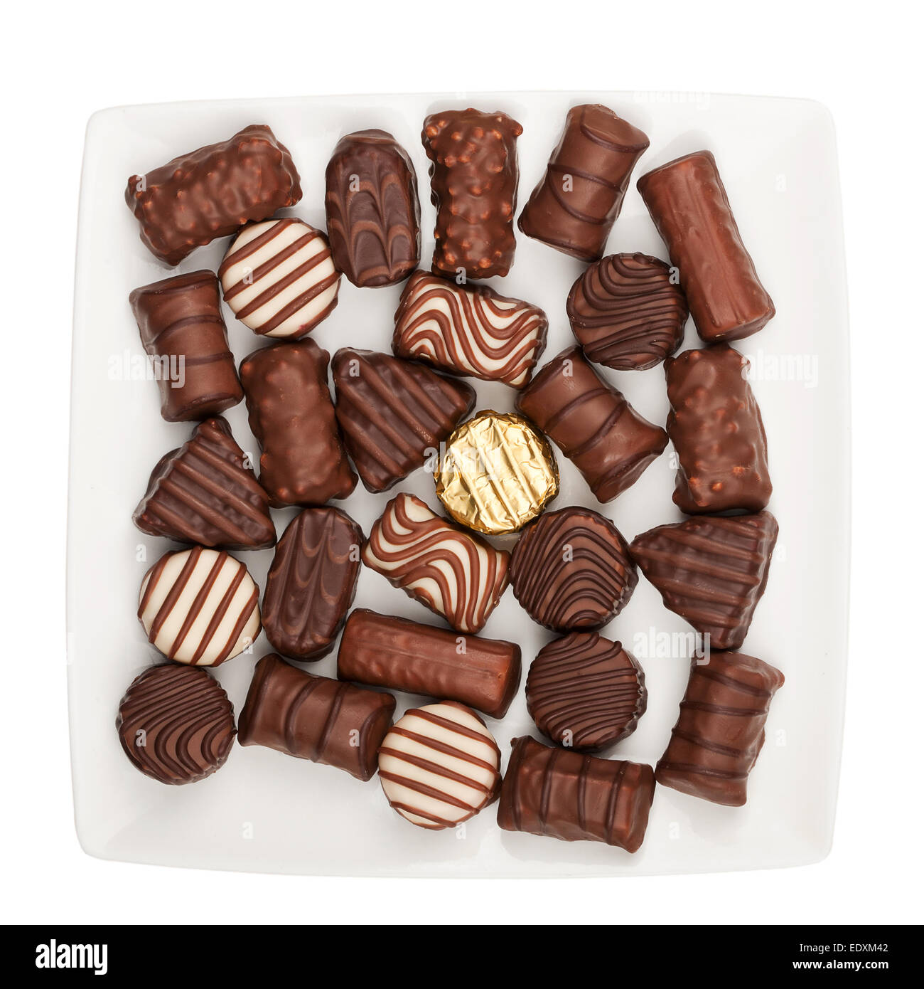 Plate of chocolates isolated on white background Stock Photo - Alamy