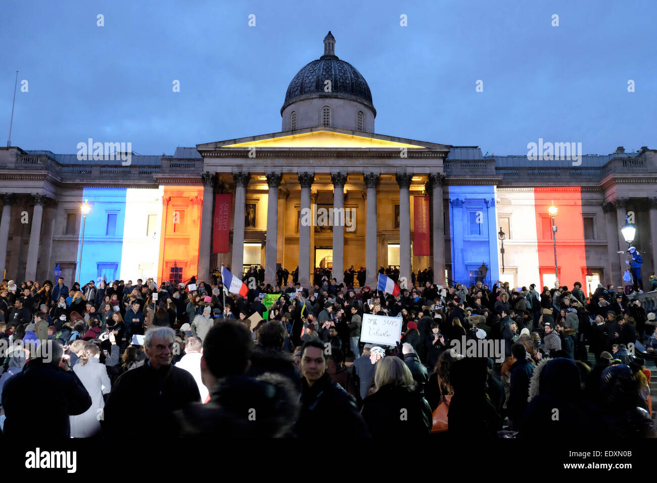 The national gallery in London is lit with the French flag colours ...