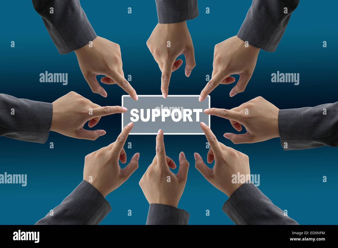 A diverse business team with hands together push Support button Stock ...