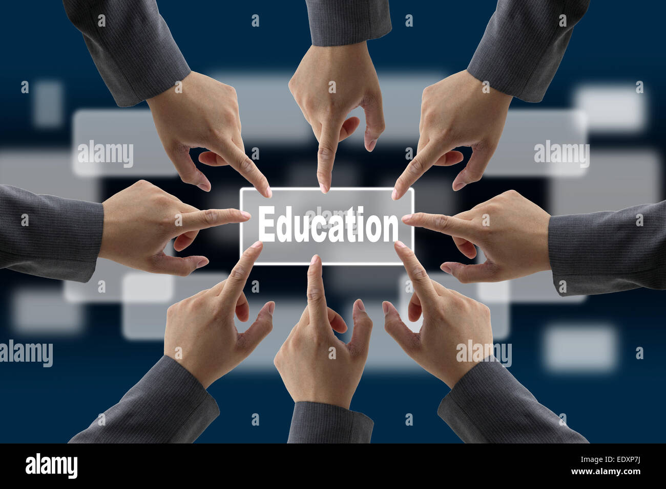 A diverse business team with hands together push Education button Stock ...