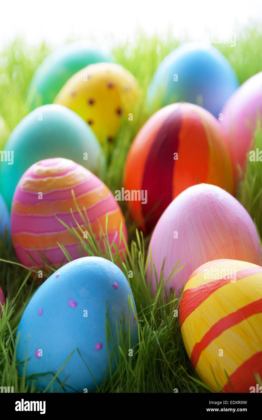 Close Up Of Many Colorful Easter Eggs On Sunny Green Gras For Easter Or ...