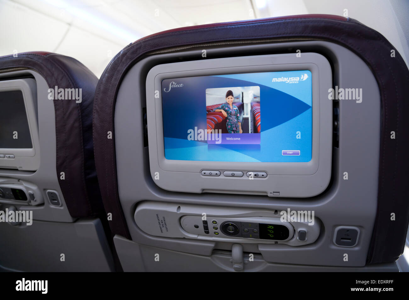 Interior of Malaysia Airlines plane seats, entertainment unit screen ...