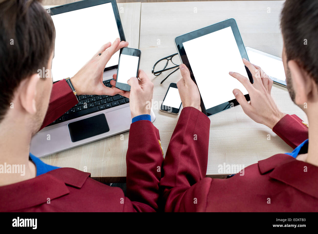 Using different digital gadgets Stock Photo - Alamy