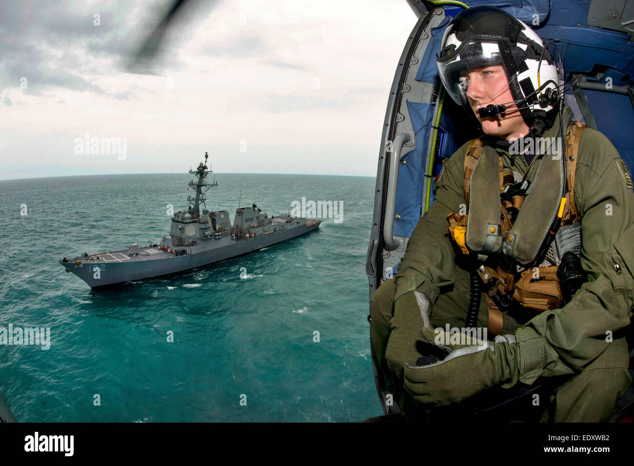 US Navy Aircrewman 2nd Class Cody Witherspoon keeps a lookout from a ...