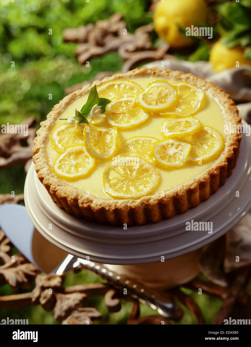 Lemon tart on wrought iron Stock Photo - Alamy