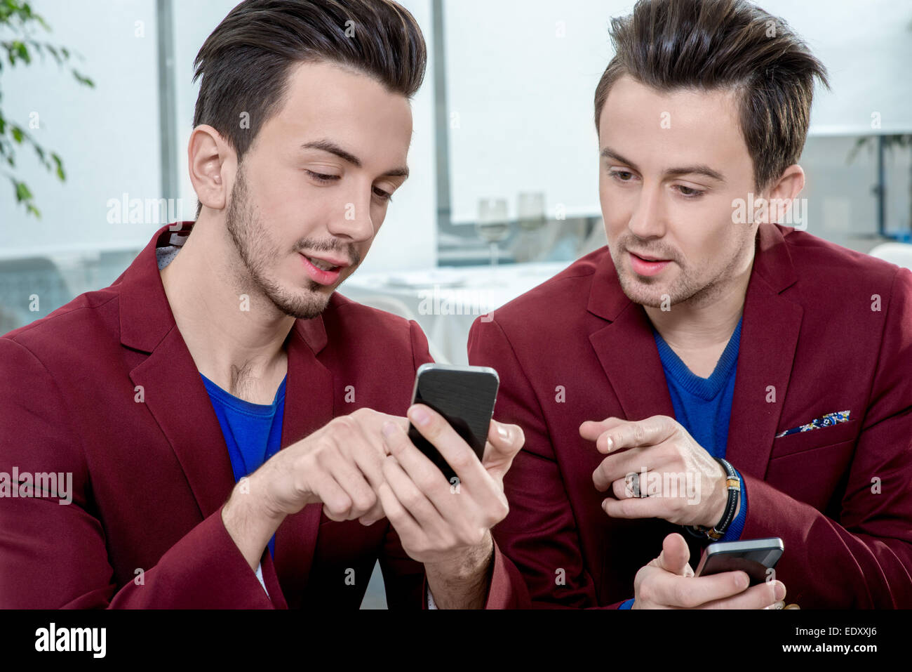 Two brothers twins working at the office Stock Photo - Alamy