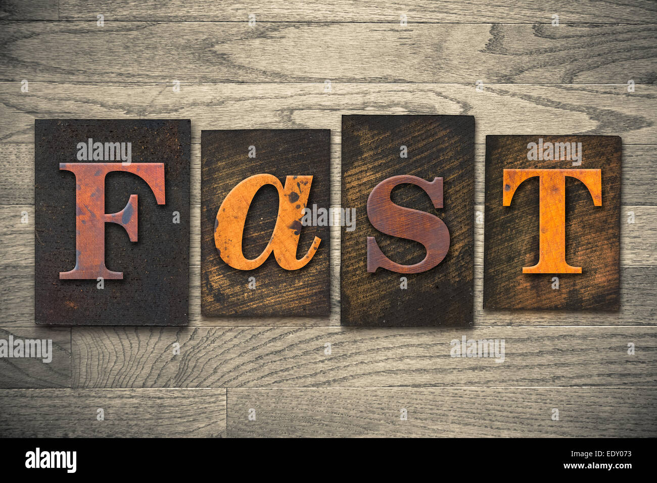 The word "FAST" written in wooden letterpress type Stock Photo - Alamy