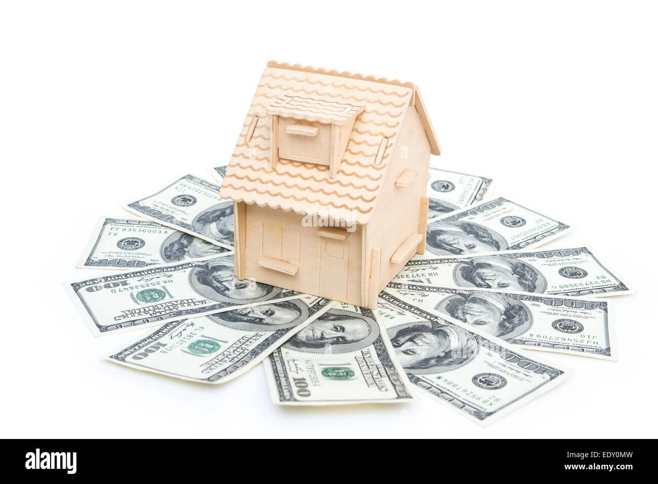 house stands on stack of USD paper currency on white Stock Photo - Alamy