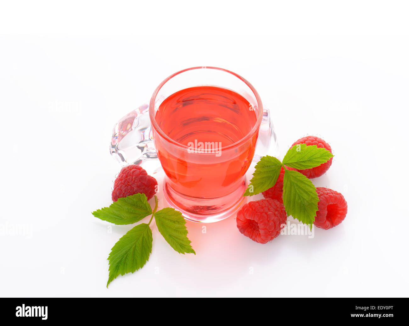 Glass of raspberry-flavored drink and fresh raspberries Stock Photo - Alamy