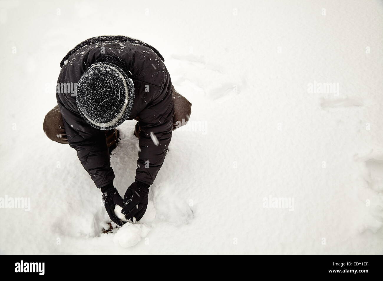 Man making snowball hi-res stock photography and images - Alamy