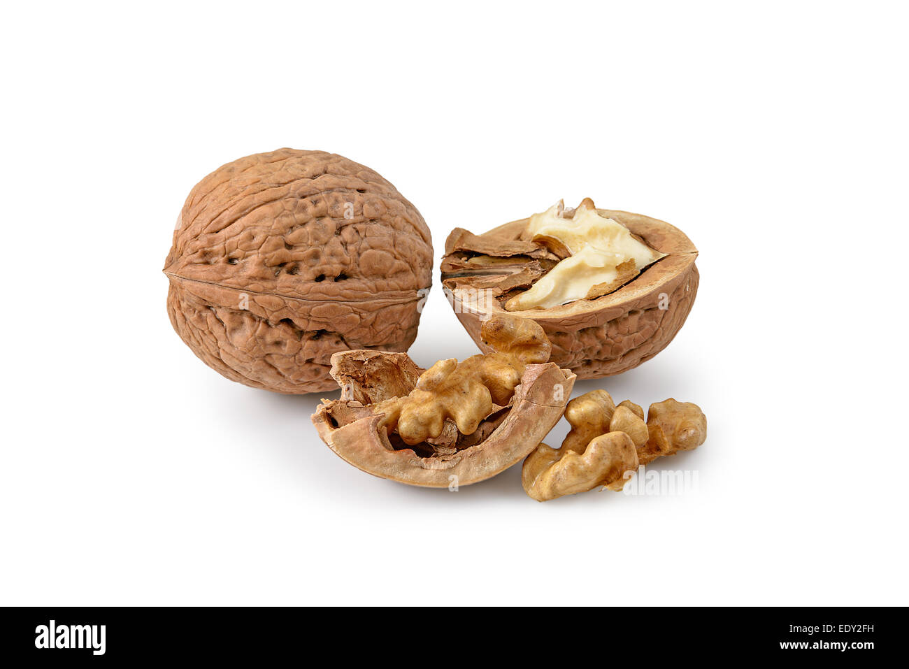 Group walnuts on brown Cut Out Stock Images & Pictures - Alamy