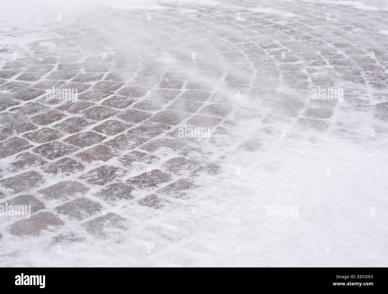 Street tiles with snow in blizzard weather in Vällingby, Stockholm ...