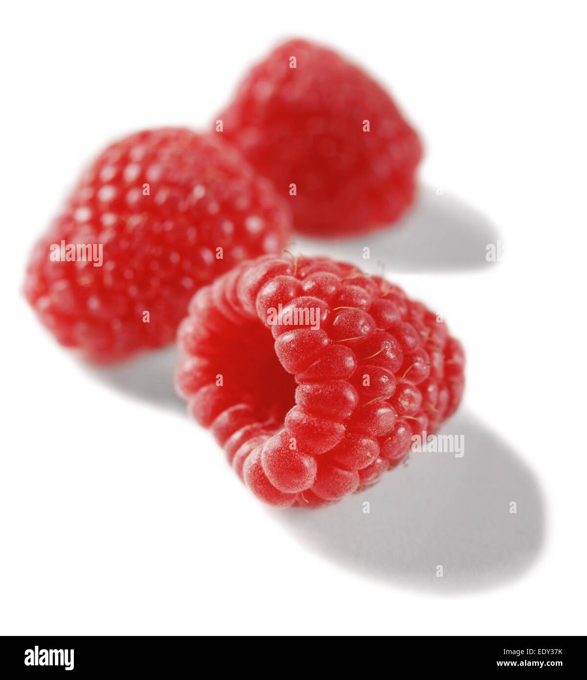 Raspberries on white background Stock Photo - Alamy