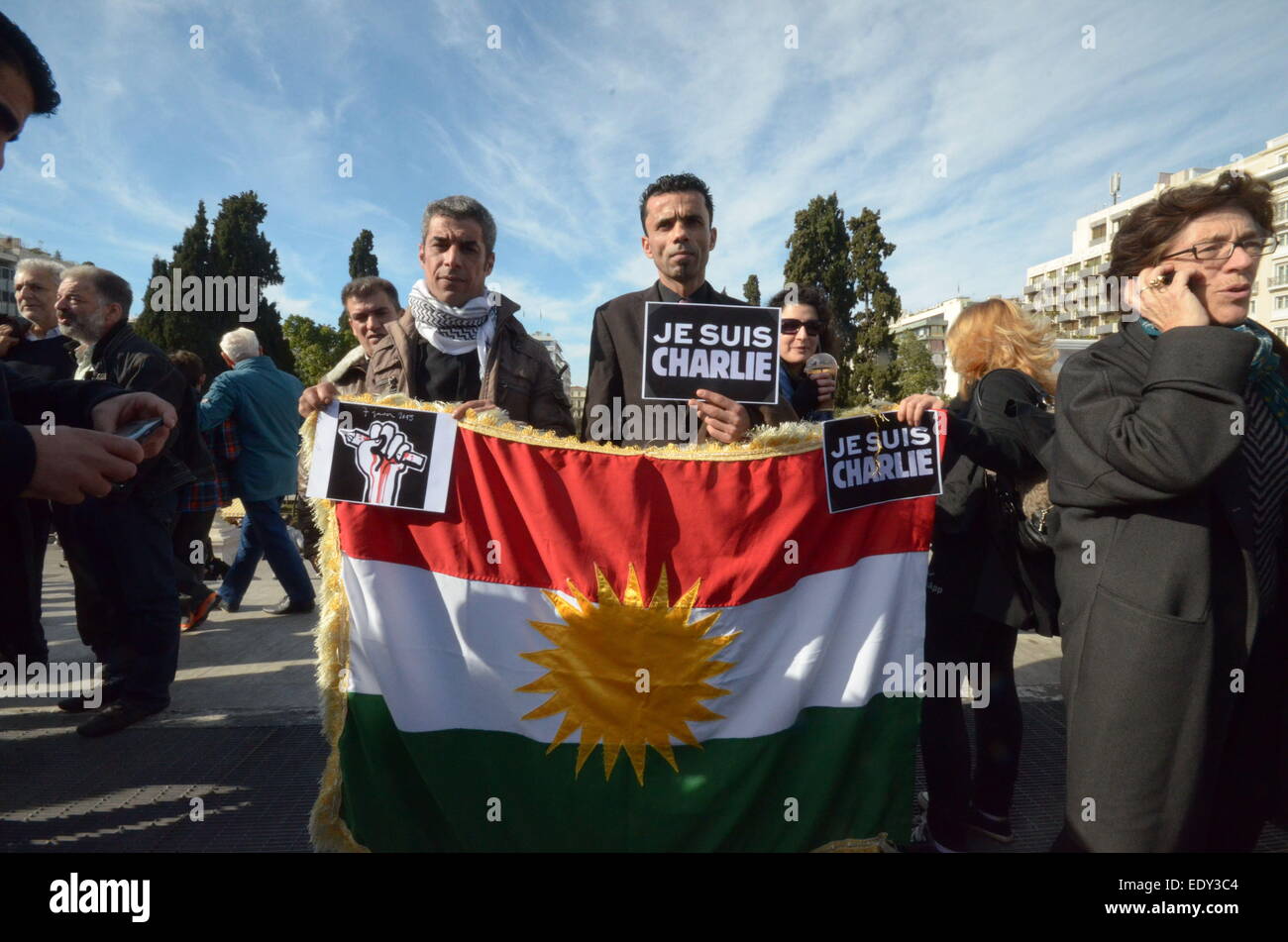 Kurdish show their support while holding a big Kurdish flag in an ...