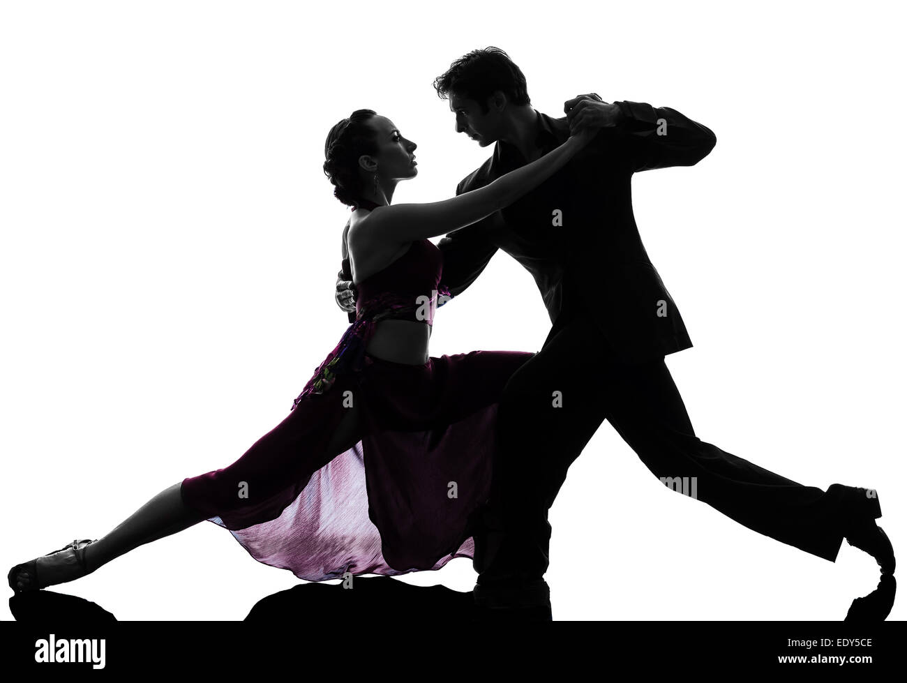 one couple man woman ballroom dancers tangoing in silhouette studio ...