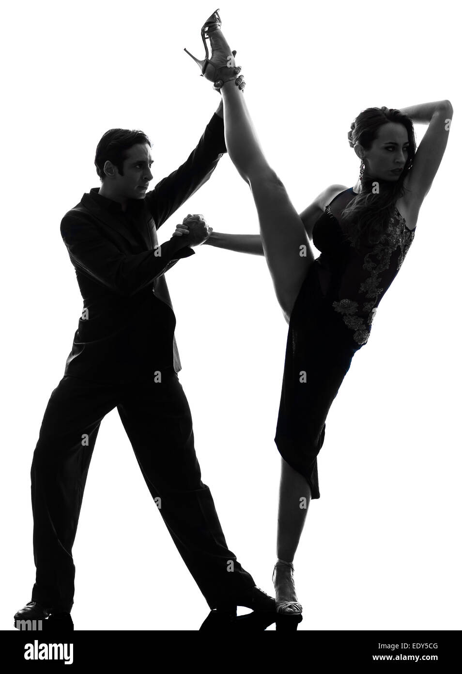 one couple man woman ballroom dancers tangoing in silhouette studio ...