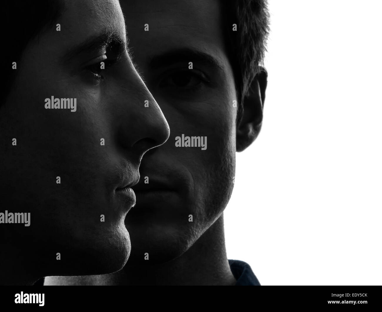 close up portrait two young men in shadow white background Stock Photo ...