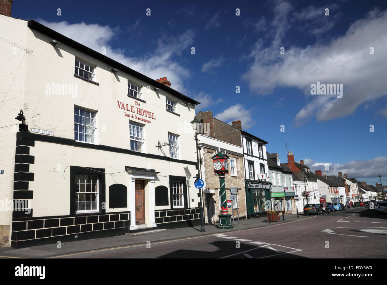 A High Street with a variety of buildings and a clock tower Stock Photo ...