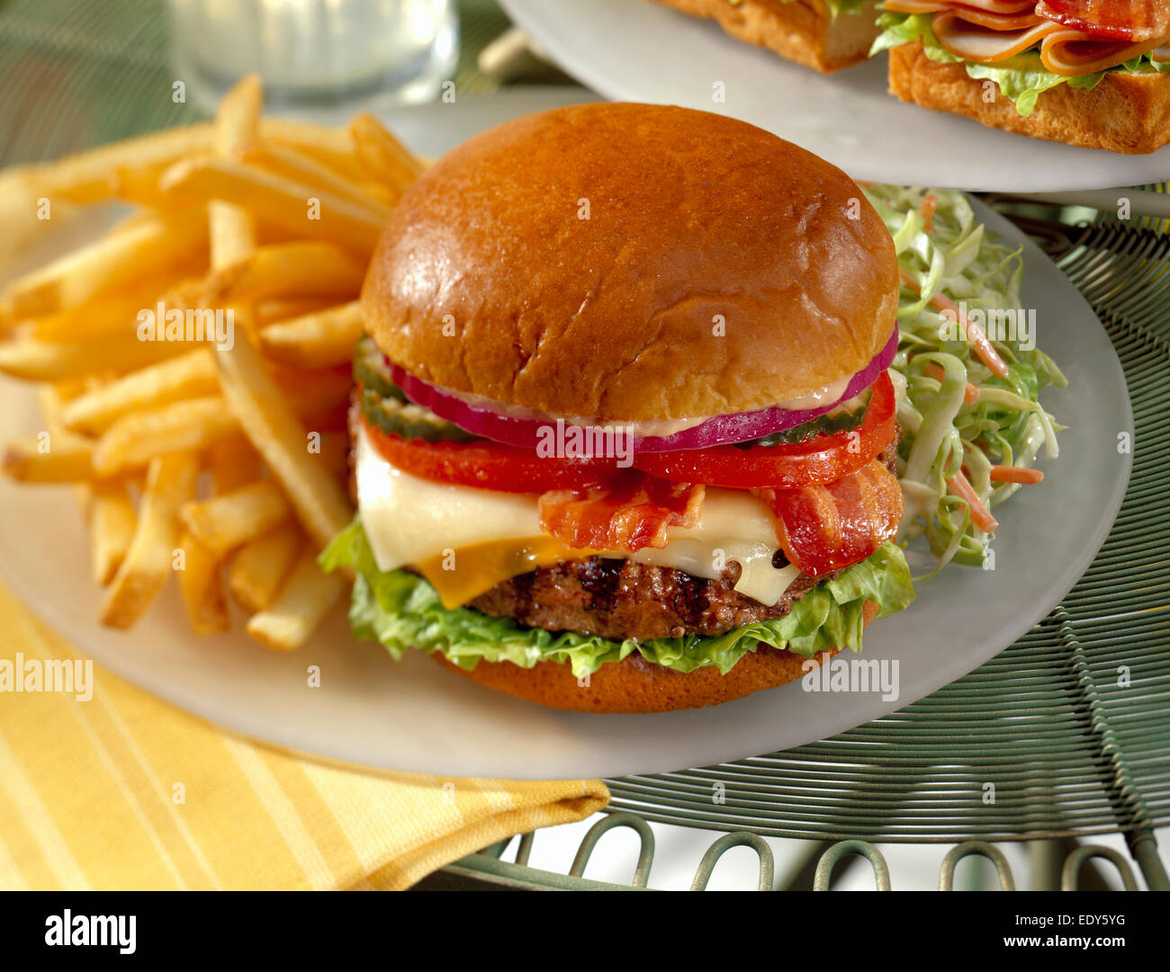 Bacon Cheese Burger with French Fries Stock Photo - Alamy