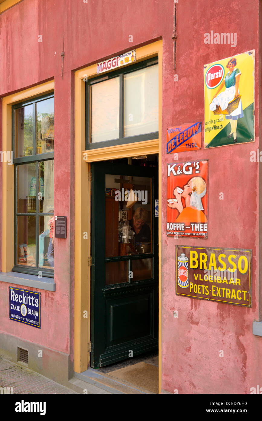 Tin signs outside a tradttional Dutch shop, Zuiderzee open air museum ...