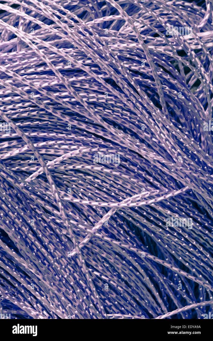 Close up of purple string as a background image Stock Photo - Alamy