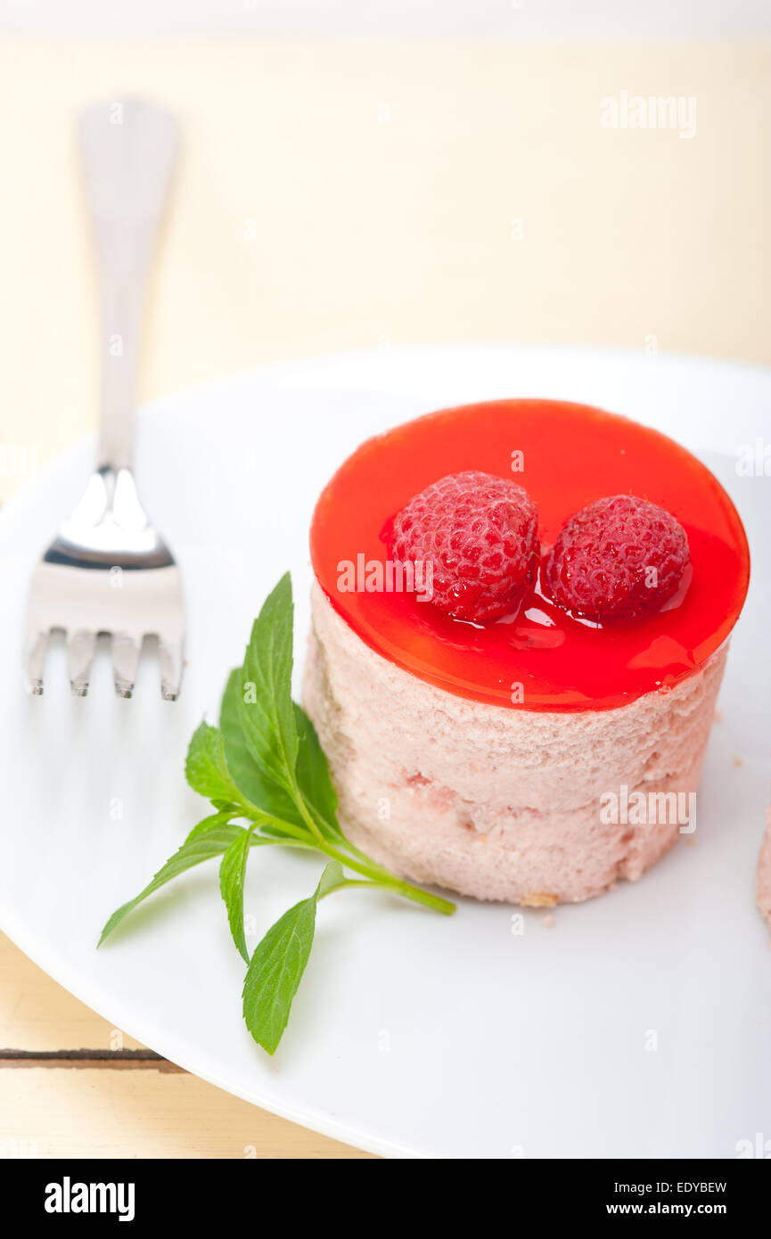 fresh raspberry cake mousse dessert round shape with mint leaves Stock ...