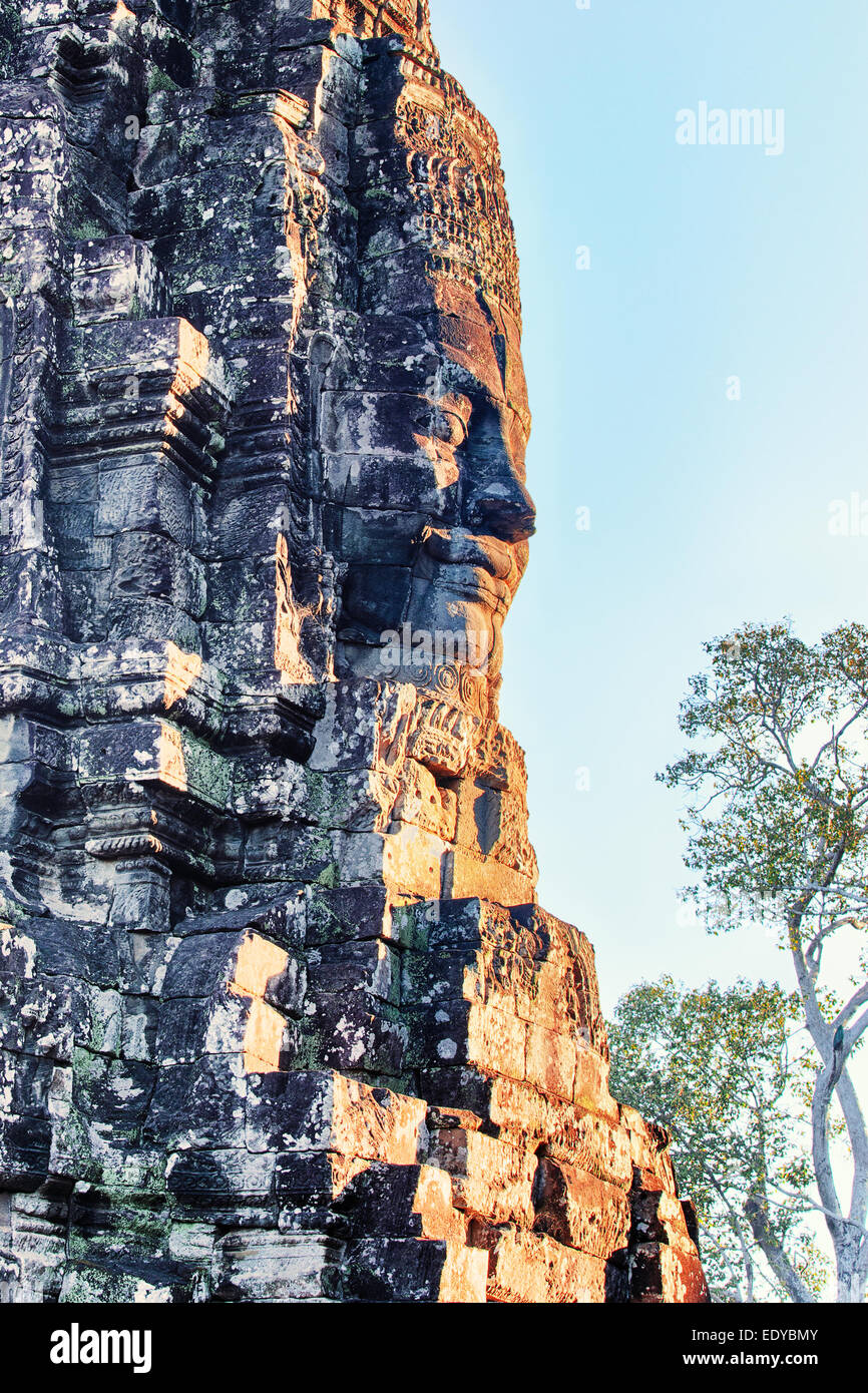 Bayon temple statue carving of the face Stock Photo - Alamy