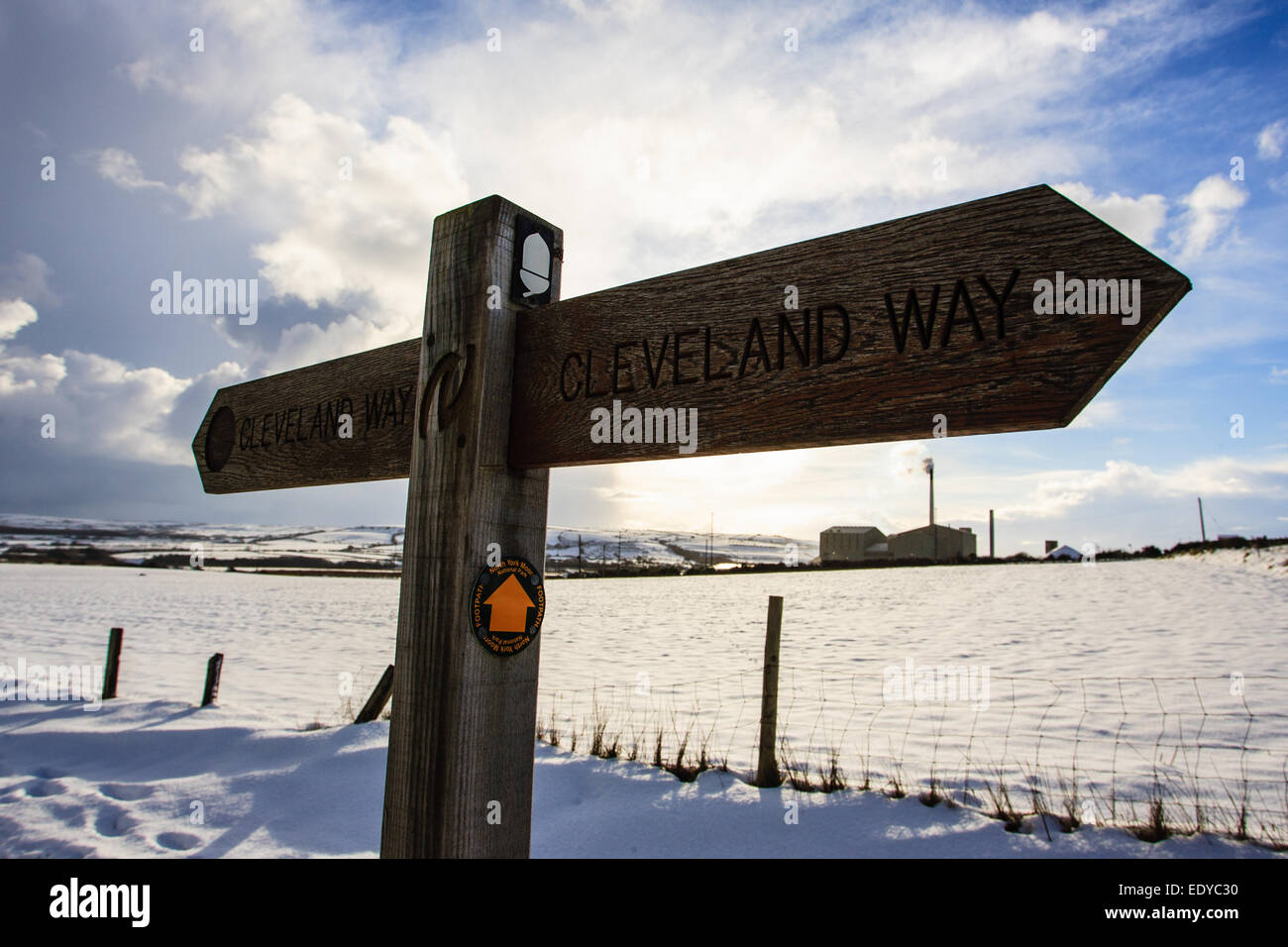 Boulby Mine behind a Cleveland Way sign post. Boulby Mine is a 200 ...