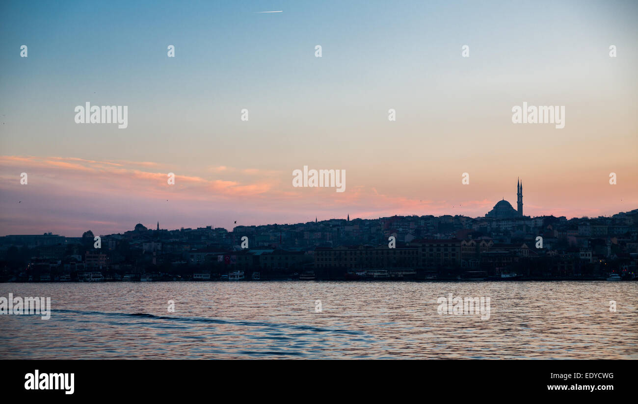 Houses and mosque high contrast skyline at sunset in Istanbul, Turkey ...