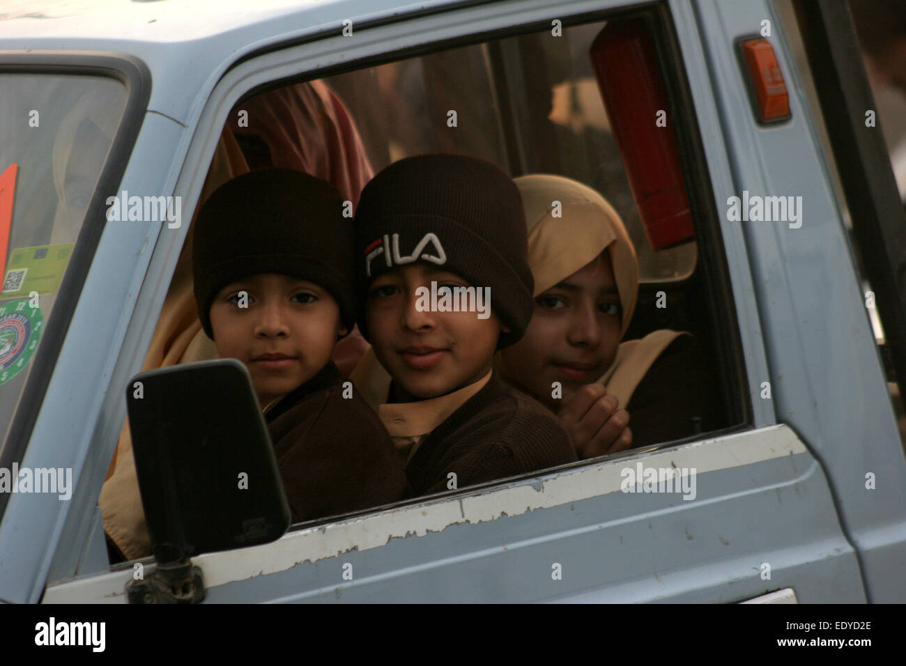 Peshawar. 12th Jan, 2015. Pakistani children travel to school in a van ...