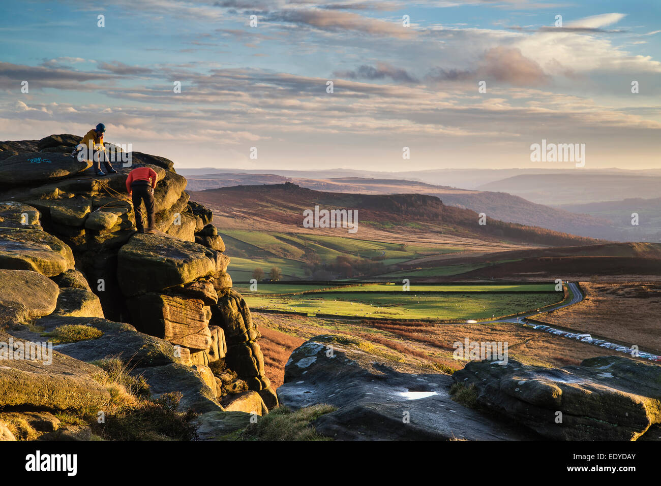 Climbers on Stanage Edge in Peak District during sunset landscape Stock ...