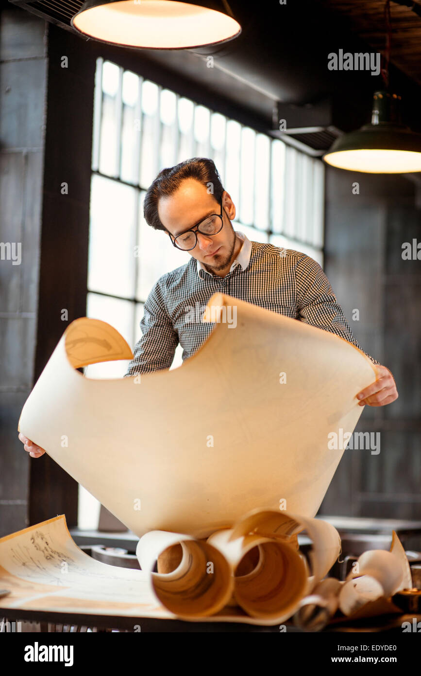 Architect working construction plan hi-res stock photography and images ...