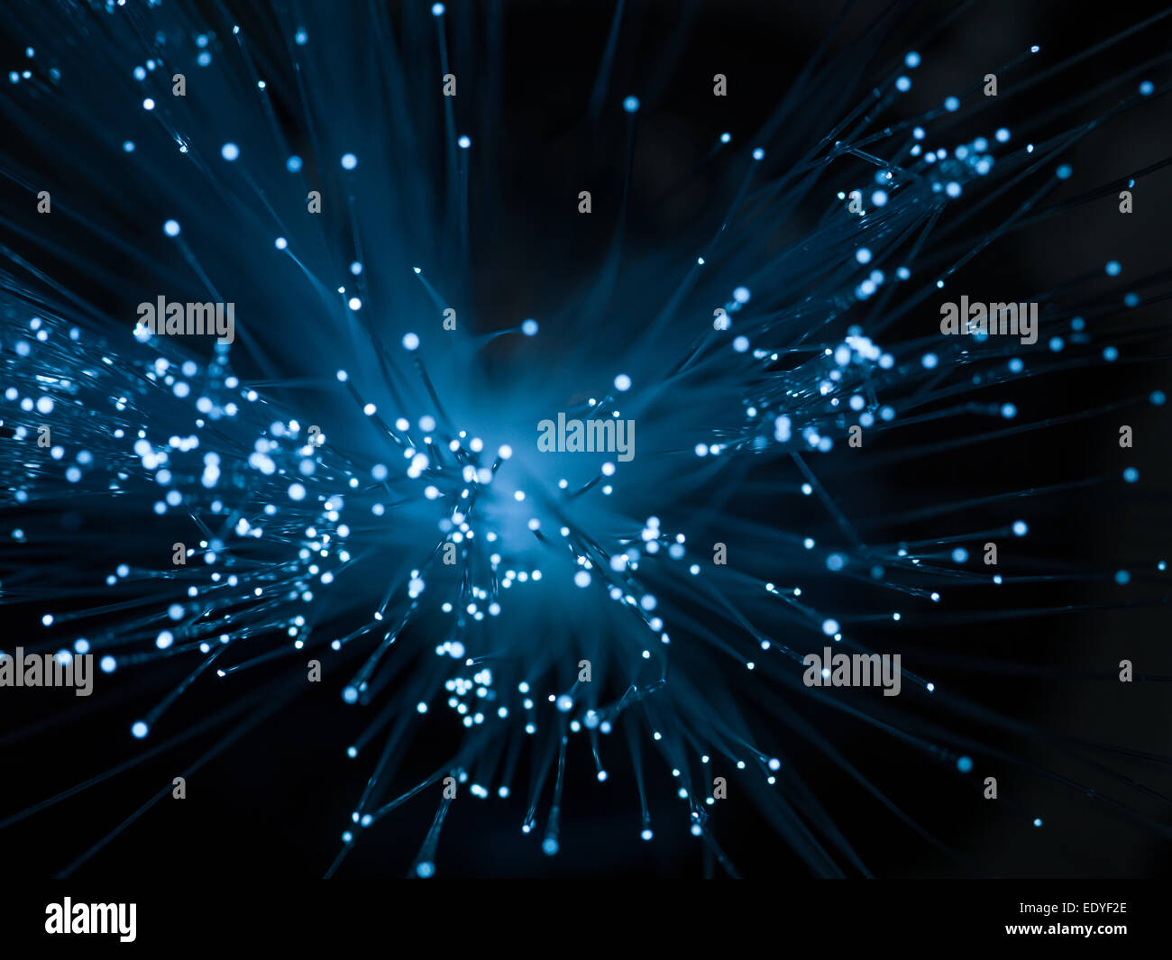 illuminated fiber optic threads on defocused background. abstract ...