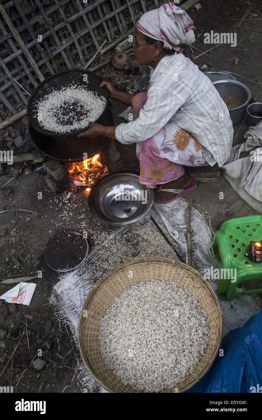 Sivasagar, Assam, India. 12th Jan, 2015. A woman prepares 'Hurum' - a ...